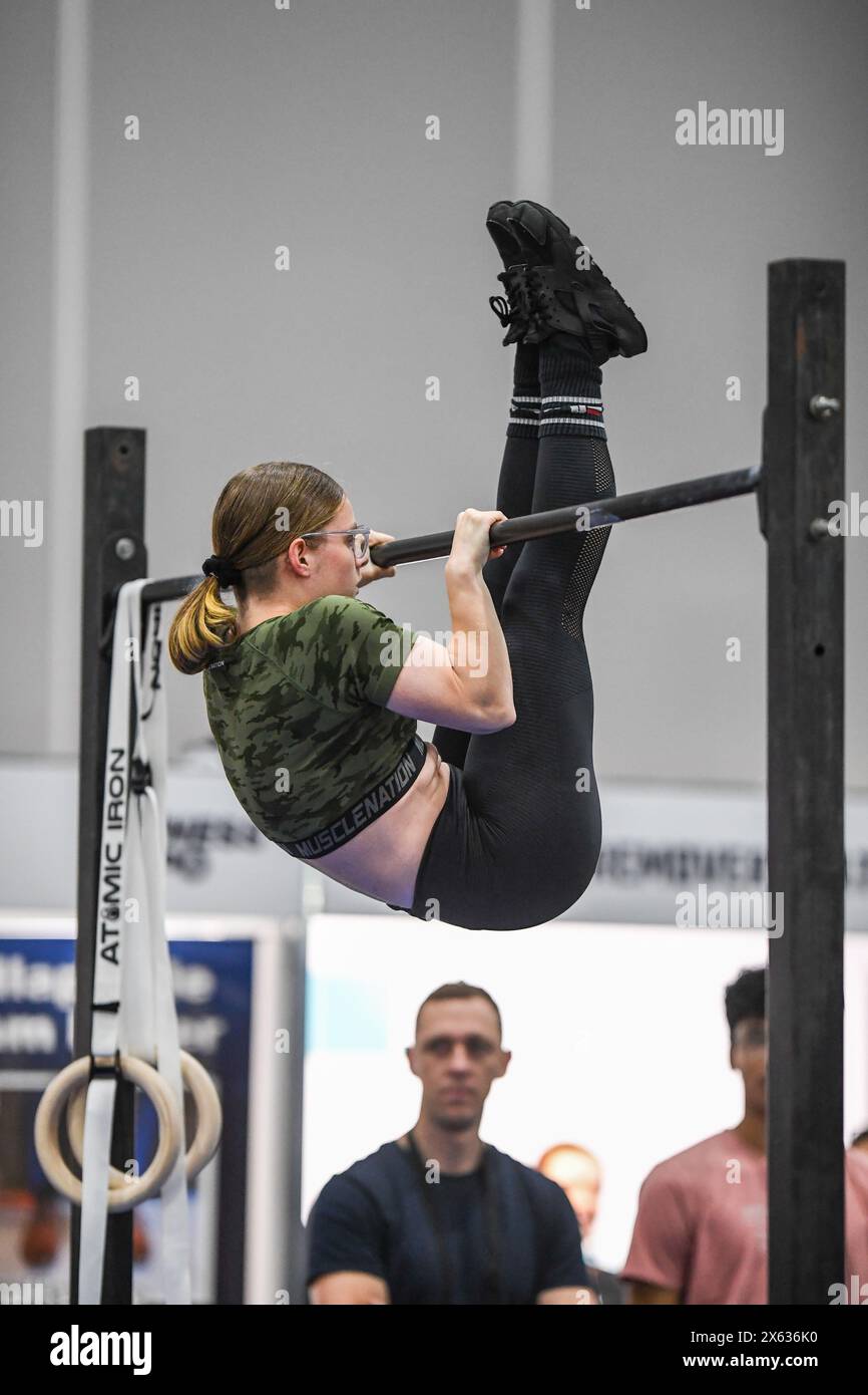 A female competitor competes in Streetlifting Calisthenics Competition ...