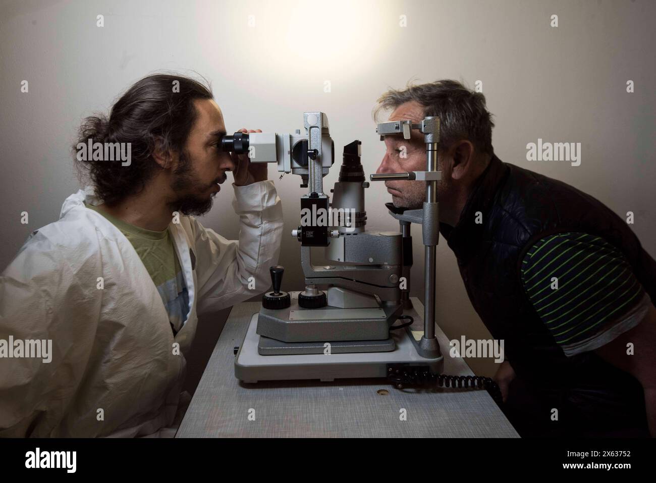 eye examination at the ophthalmologist, checking the eyesight with a ...