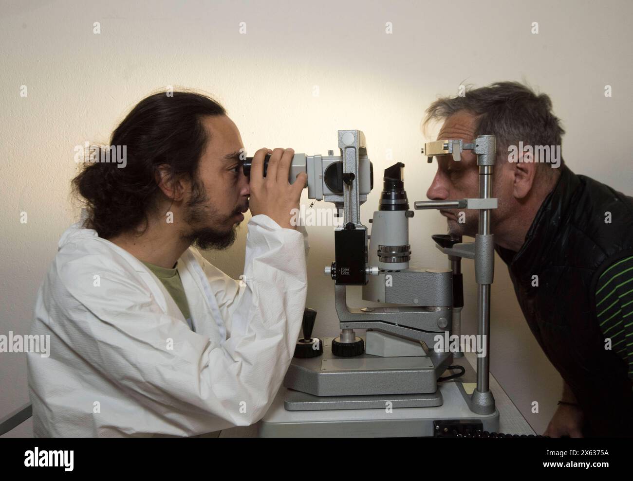 eye examination at the ophthalmologist, checking the eyesight with a ...
