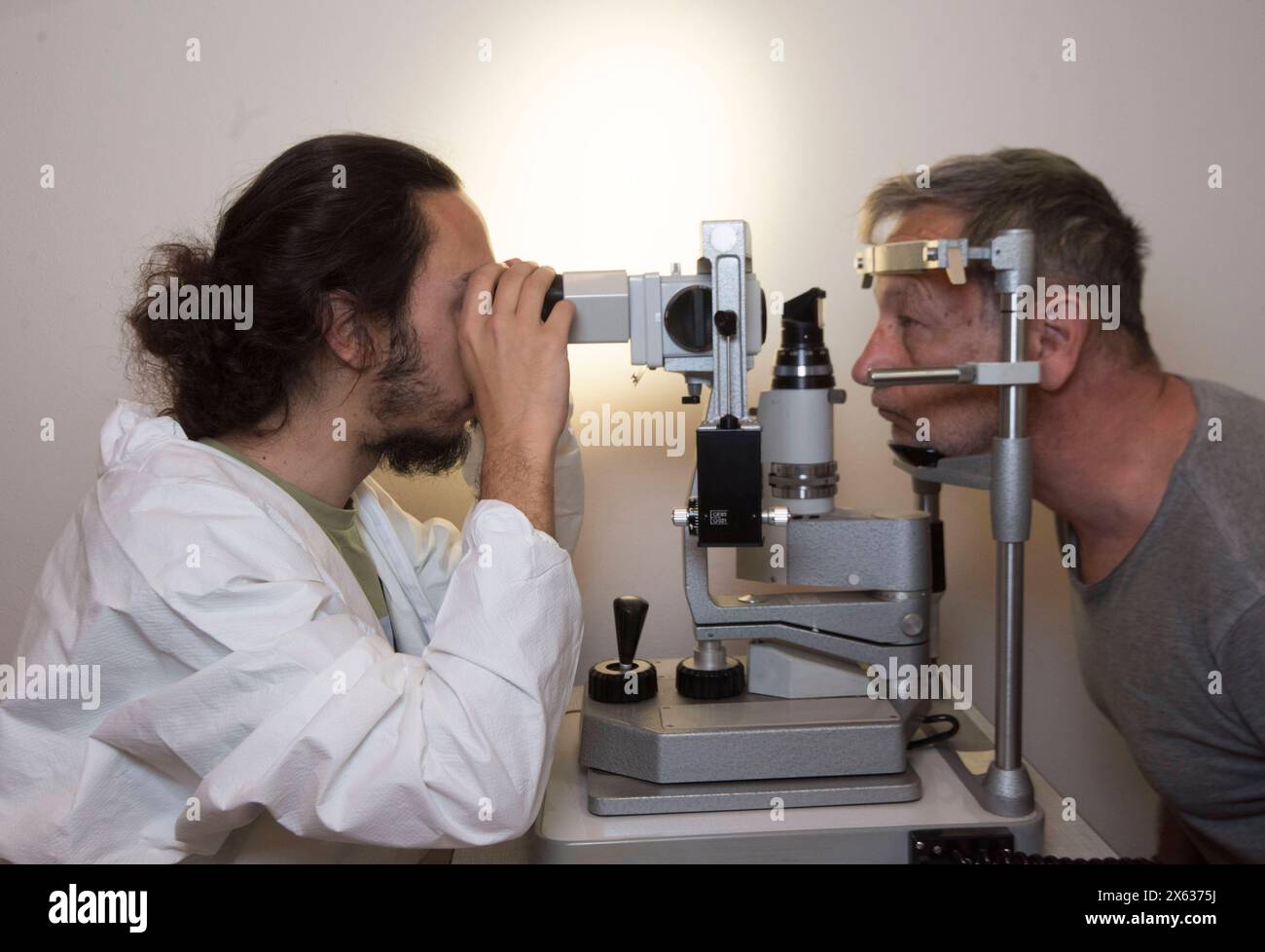eye examination at the ophthalmologist, checking the eyesight with a ...