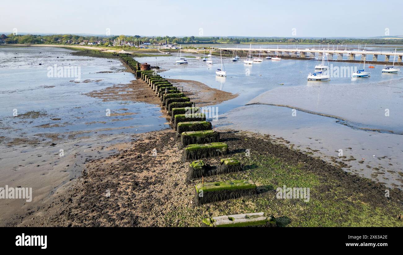 Remains of old railway bridge from Langstone (top of picture) to ...