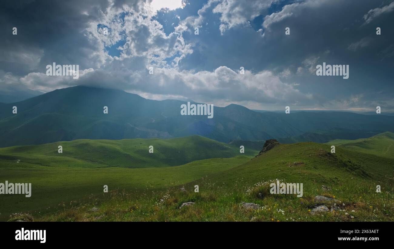 Mountain landscape with sun rays Stock Photo - Alamy
