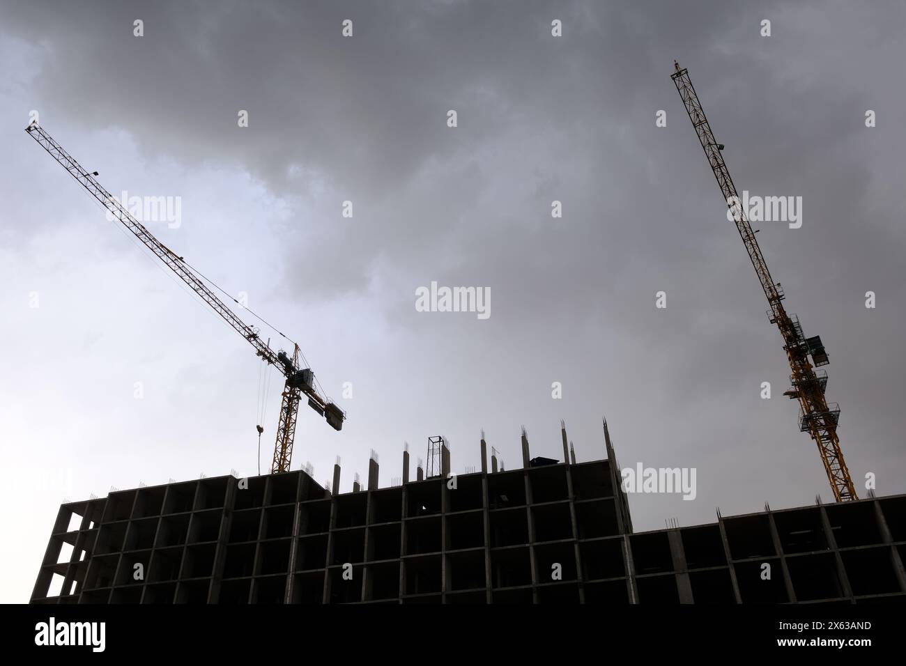 The building cranes rotates from the wind. Strong wind. Crane on ...