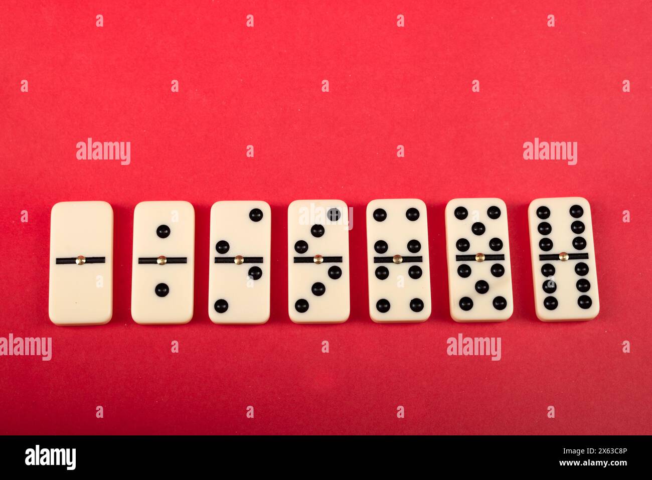 Dominoes with red background, copy space and various angles, board ...