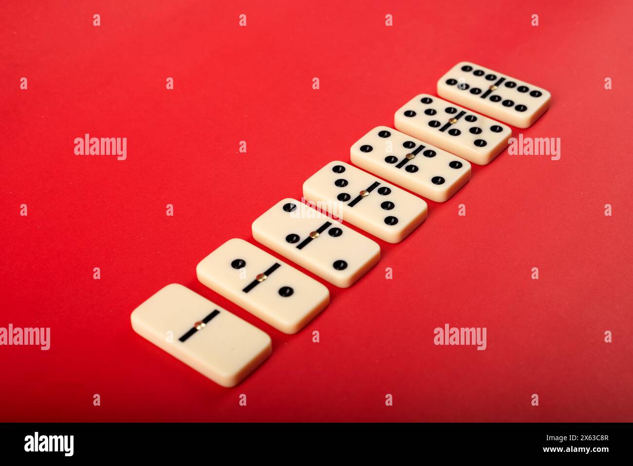 Dominoes with red background, copy space and various angles, board ...