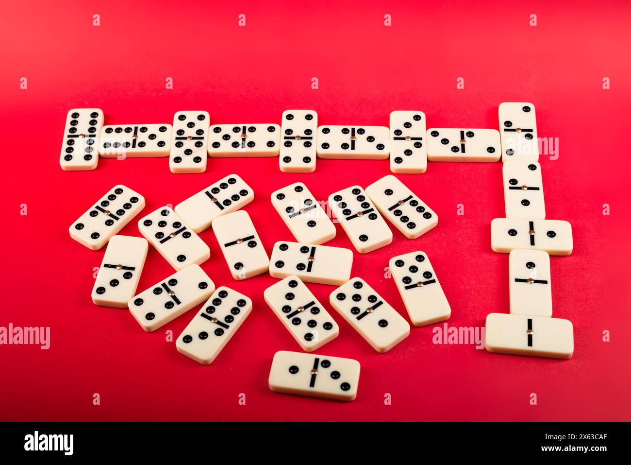Dominoes with red background, copy space and various angles. White ...