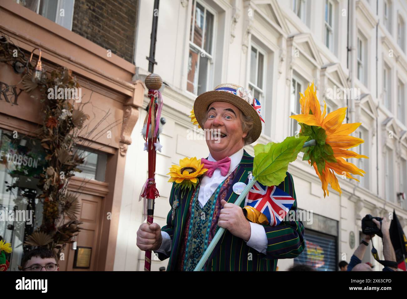 London, UK. 12th May 2024.Stilt performer Professor Crump aka Paul ...