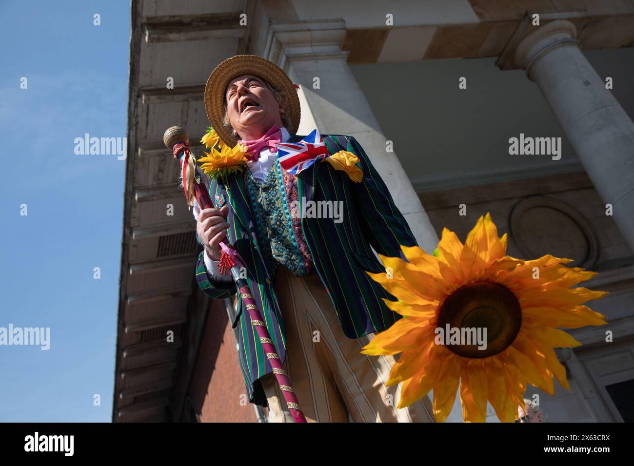 London, UK. 12th May 2024.Stilt performer Professor Crump aka Paul ...