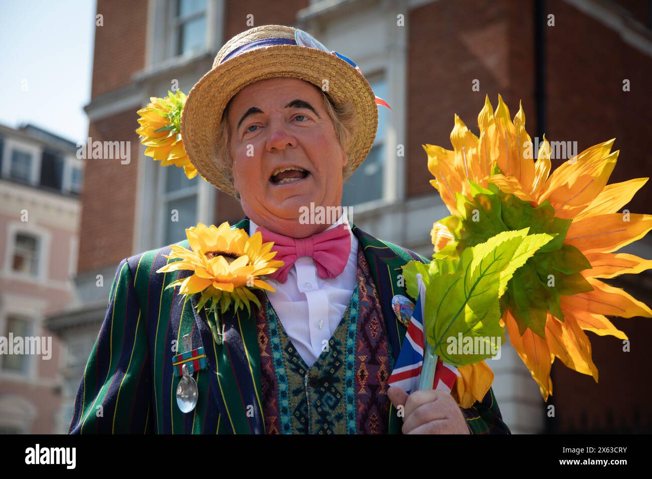 London, UK. 12th May 2024.Stilt performer Professor Crump aka Paul ...