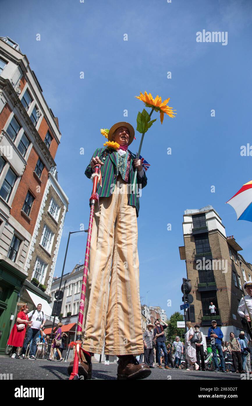 London, UK. 12th May 2024.Stilt performer Professor Crump aka Paul ...