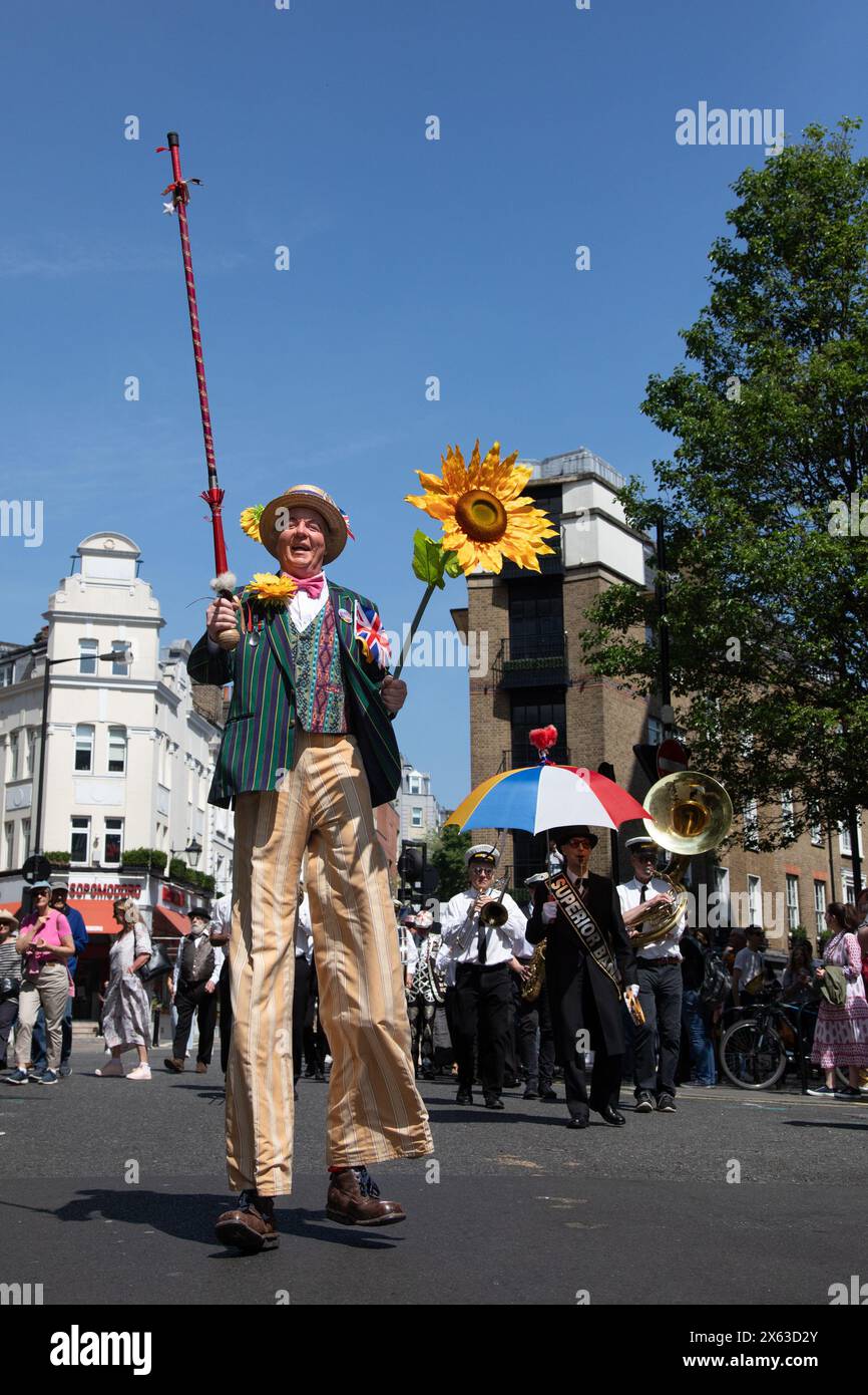 London, UK. 12th May 2024.Stilt performer Professor Crump aka Paul ...