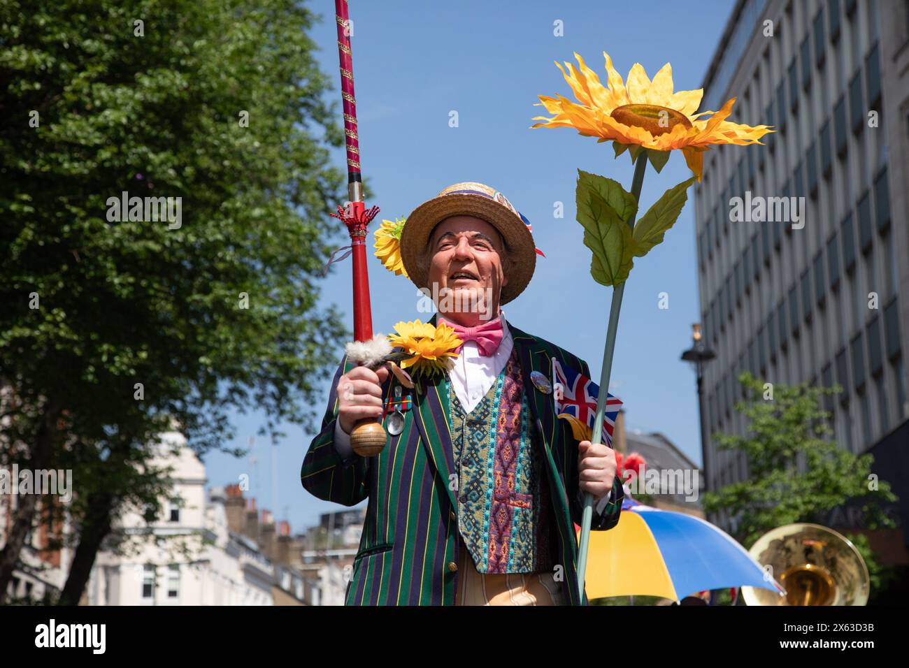 London, UK. 12th May 2024.Stilt performer Professor Crump aka Paul ...