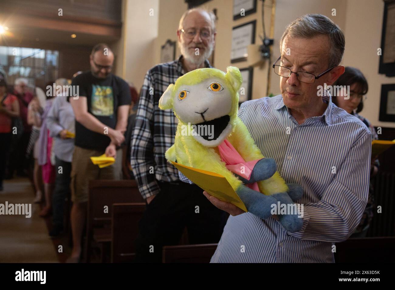London, UK. 12th May 2024. Puppets, puppeteers and spectators sing ...
