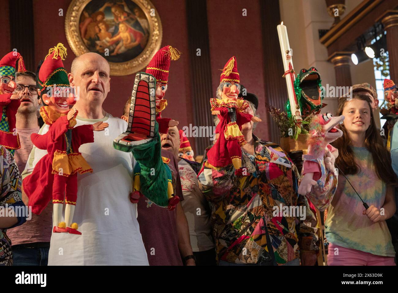 London, UK. 12th May 2024. Puppets, puppeteers and spectators sing ...