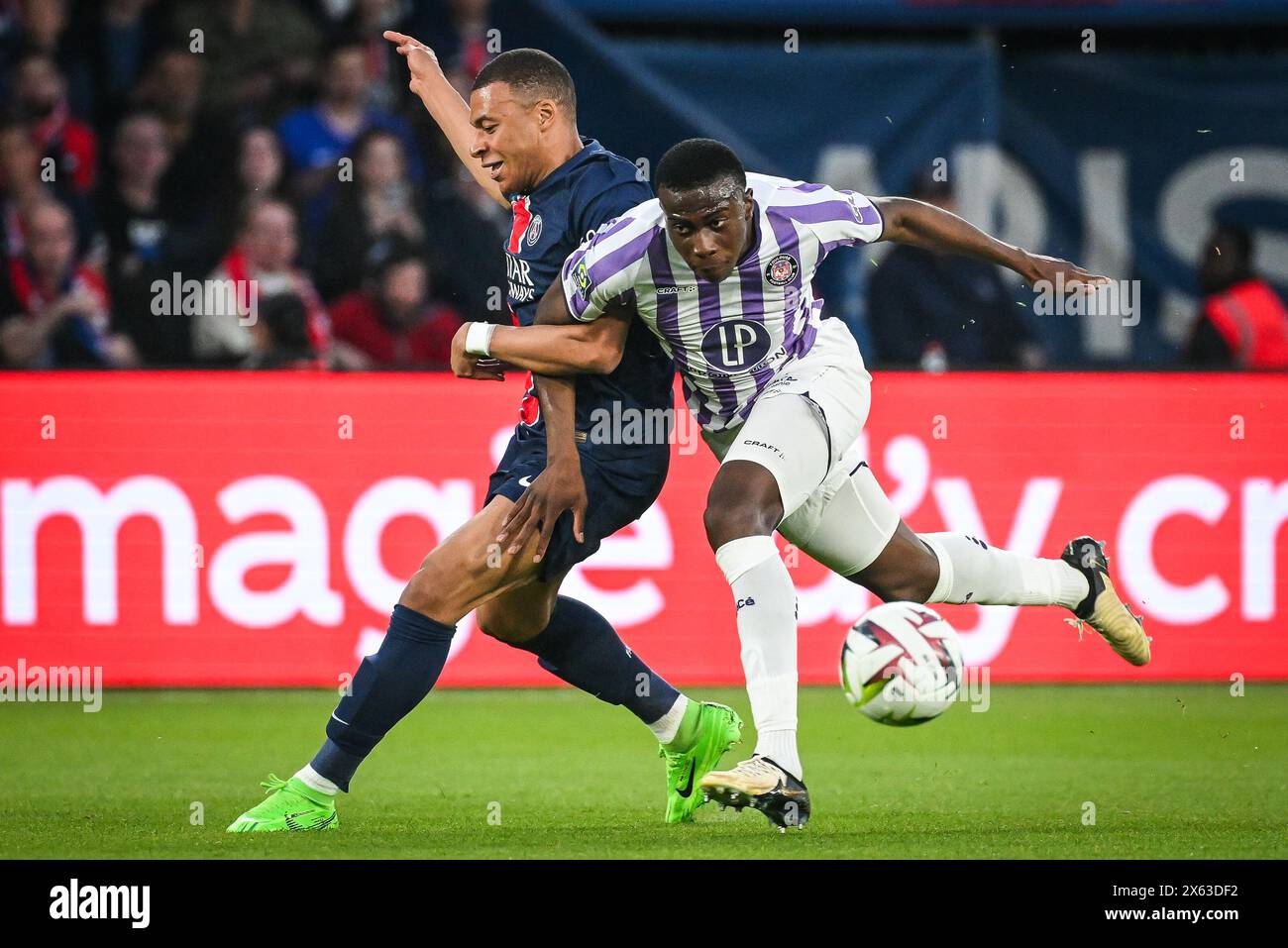 Kylian MBAPPE of PSG and Kevin KEBEN of Toulouse during the French ...