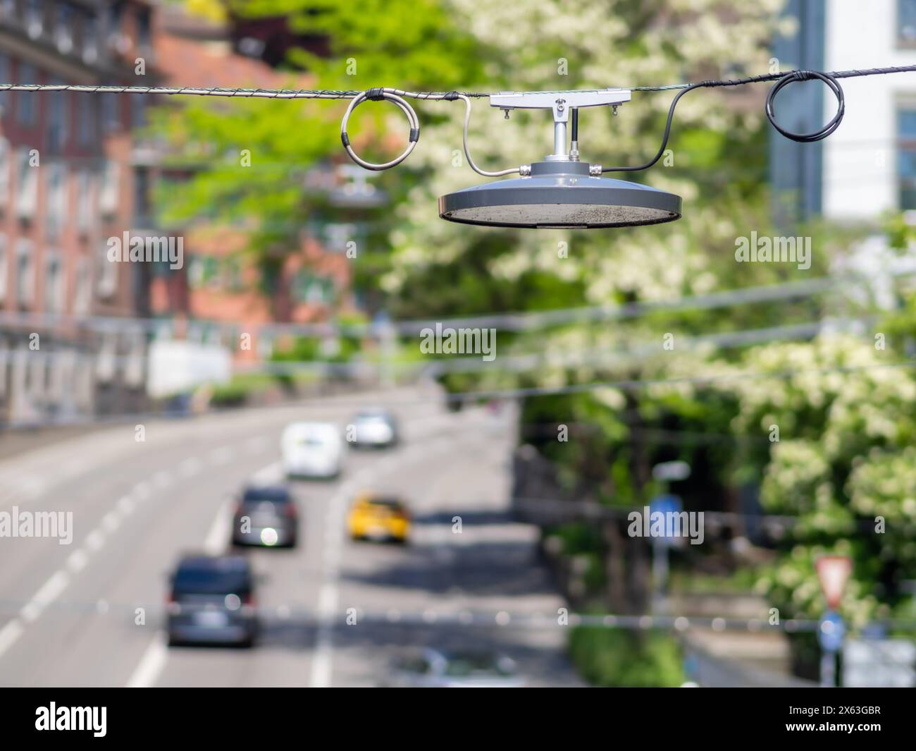 A bright sunny day in the city, a sharp focus on an overhanging street ...
