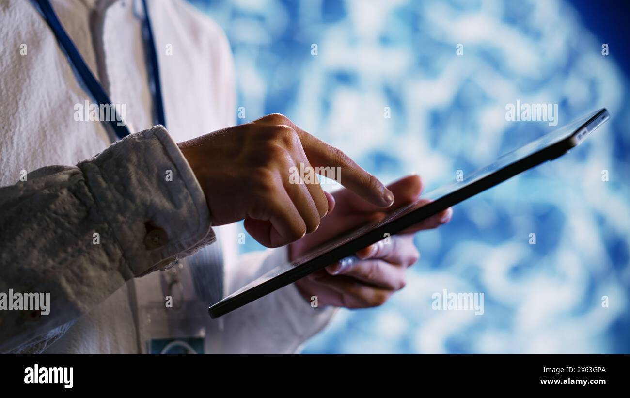 Licensed employee using tablet to maintenance artificial intelligence neural networks made up of ...