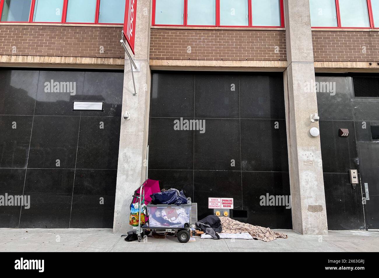 New York, United States. 09th May, 2024. An unhoused person sleeps on a ...
