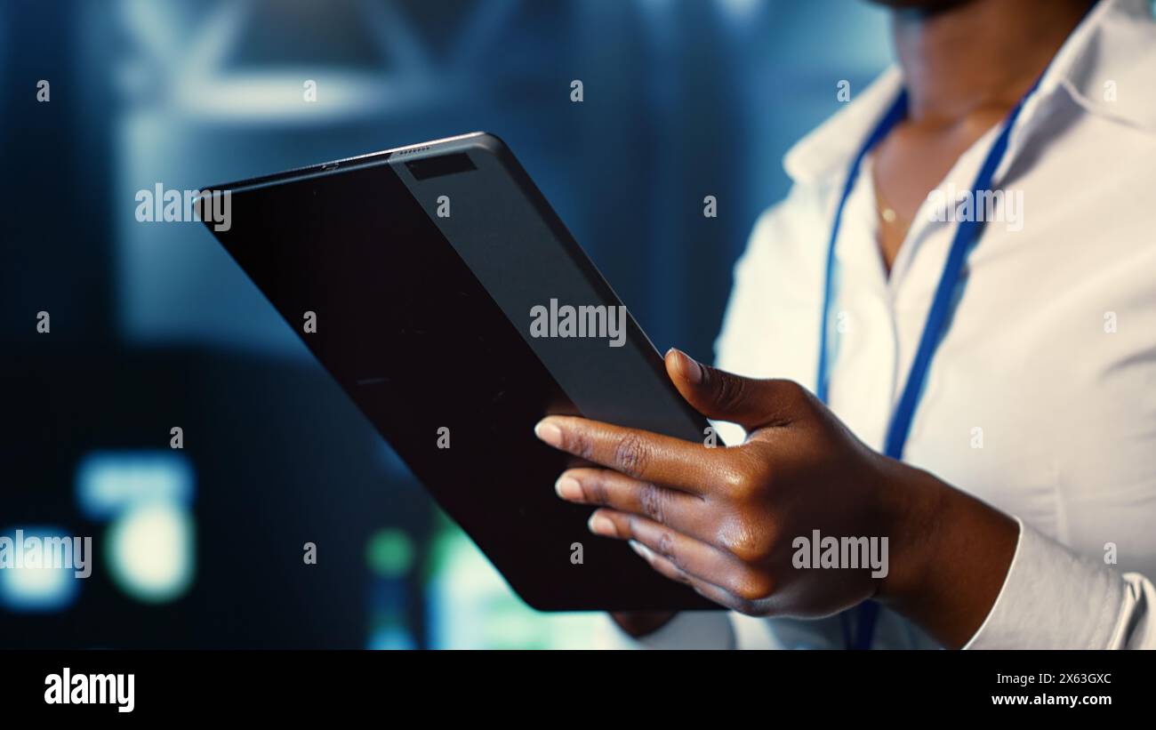 Woman Walking Through Server Room Rows Providing Computing Resources For Different Workloads