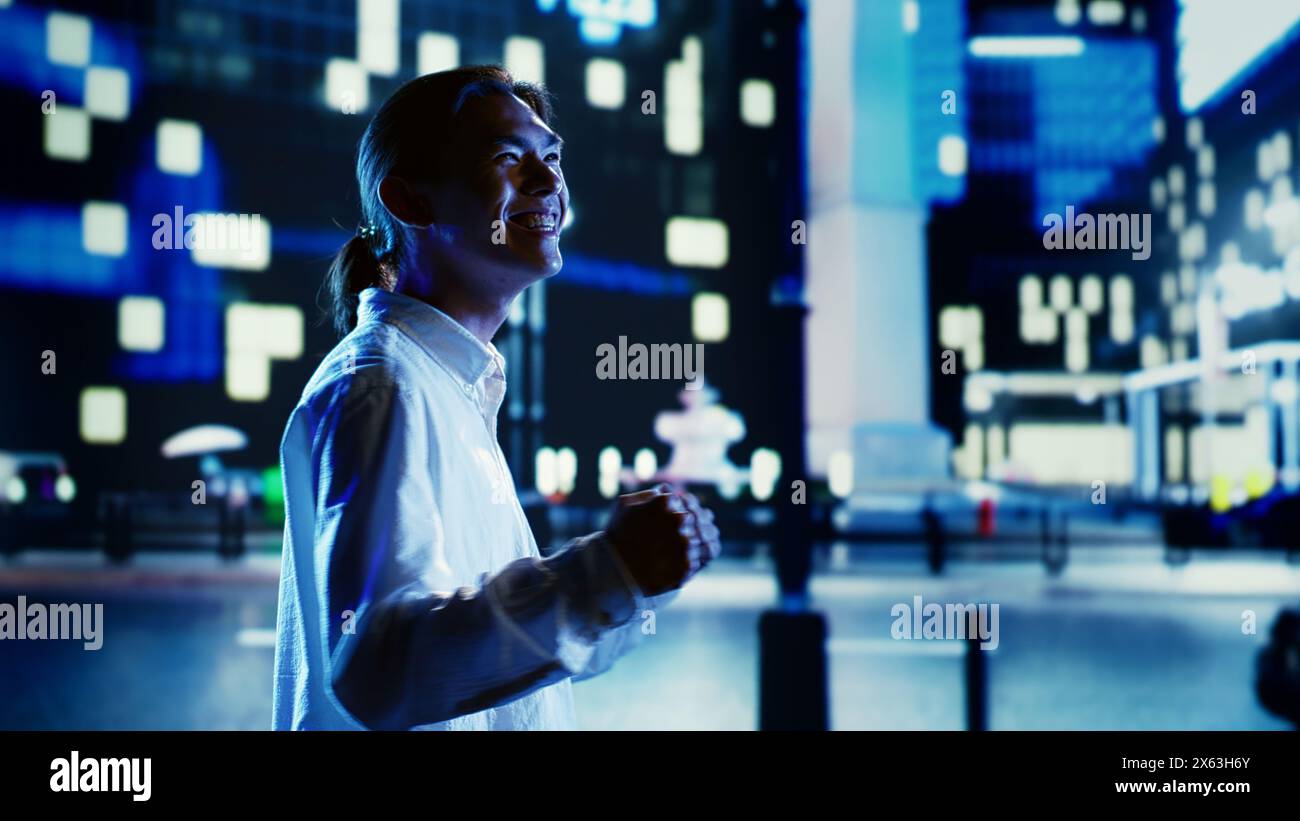 Asian man wandering around city streets at night, laughing and feeling grateful in empty urban ...