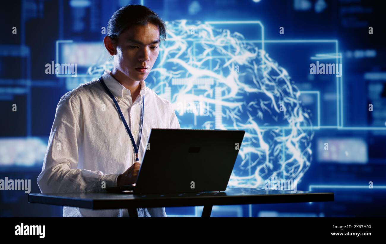 Admin using laptop to visualize artificial intelligence neural networks made up of ...