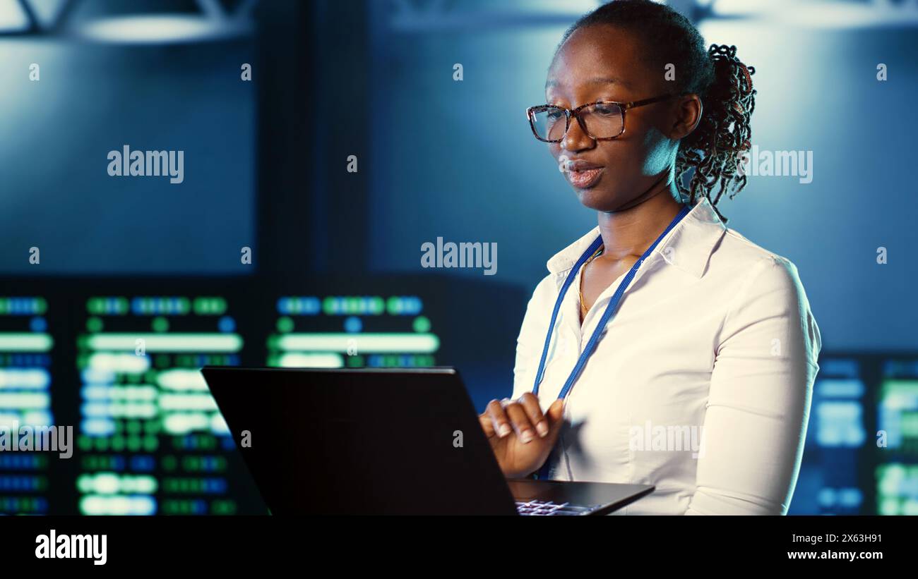 Woman Walking Through High Tech Facility Server Rows Providing Computing Resources For Different 