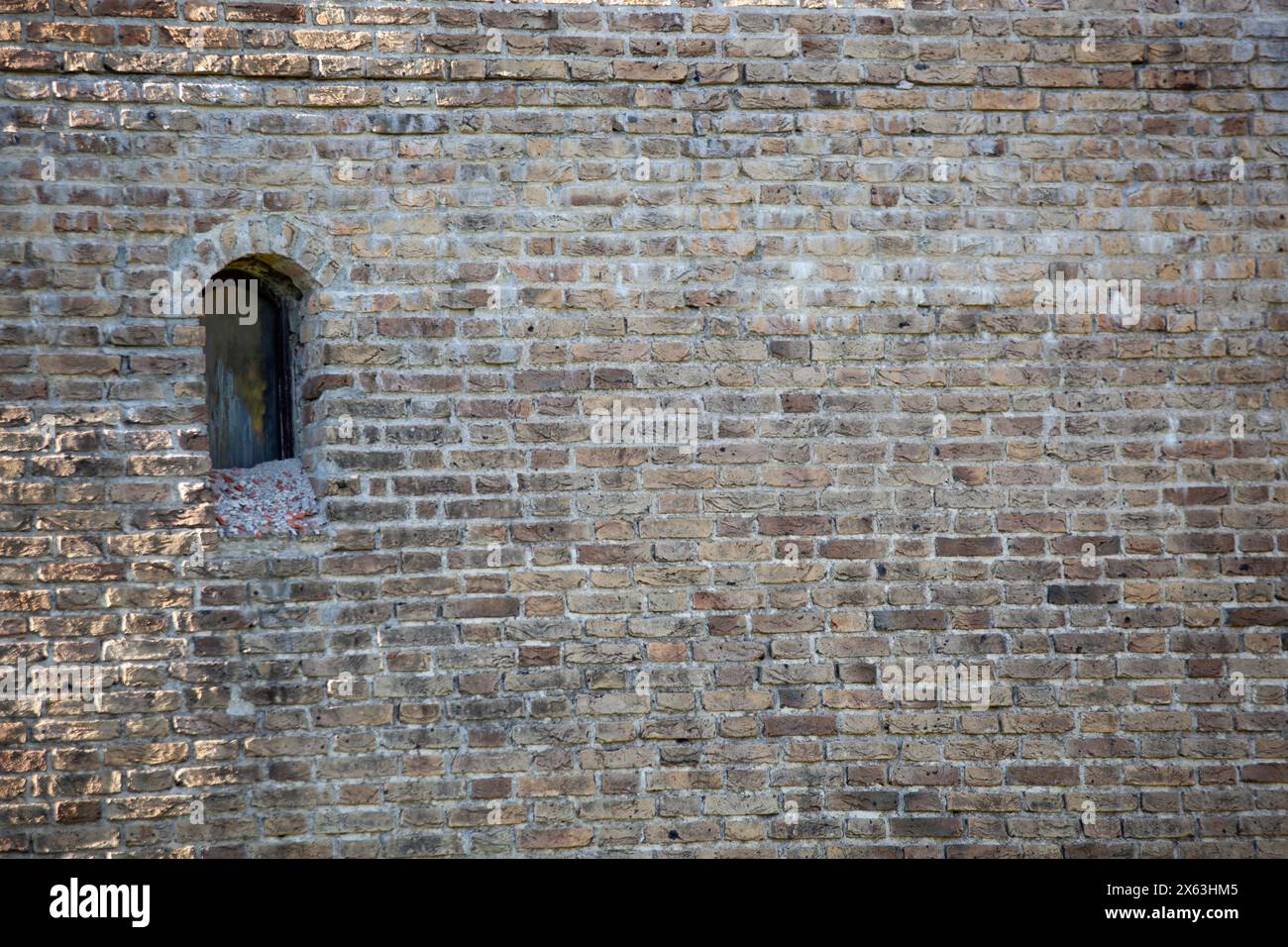 Broken stone texture on old grey wall with arched window in Tallinn ...