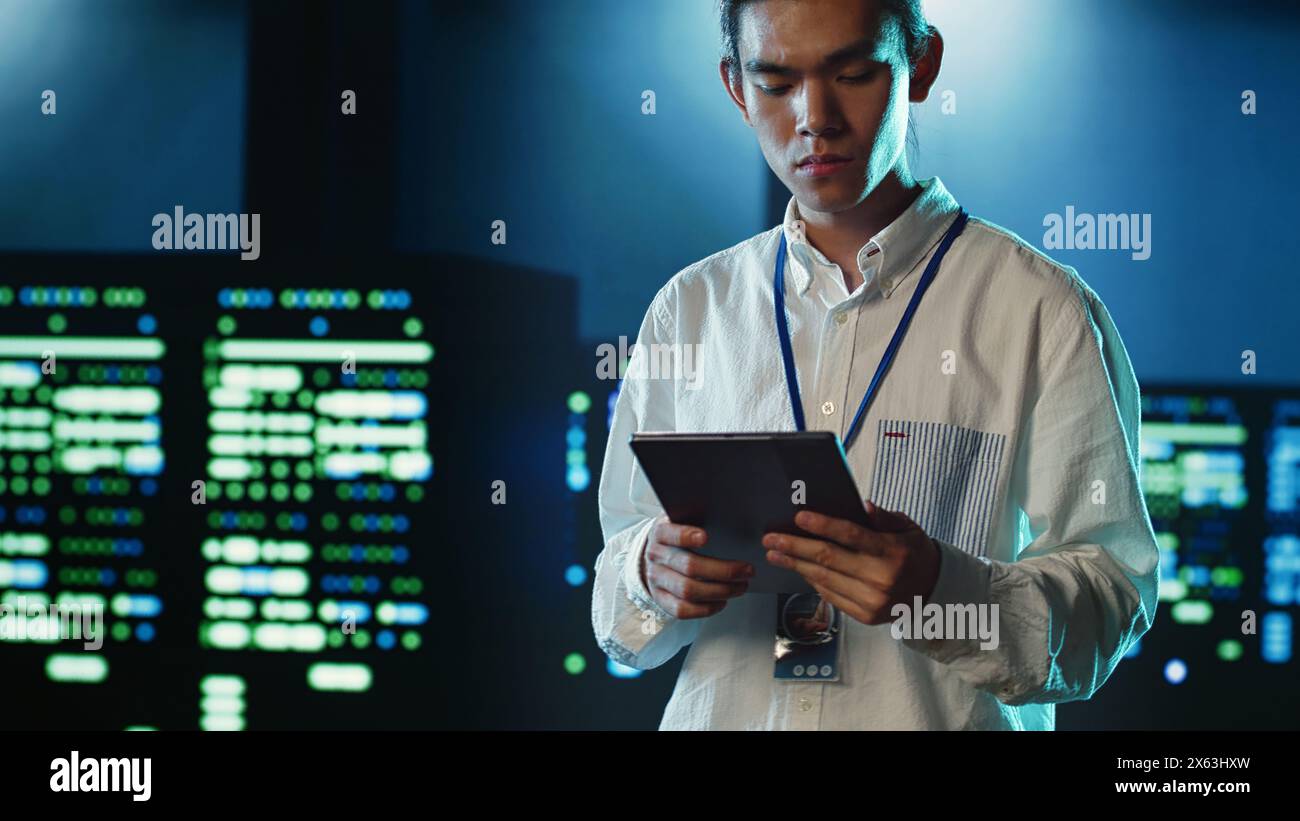 Licensed Programmer Strolling Through Server Rows Providing Processing Resources For Different