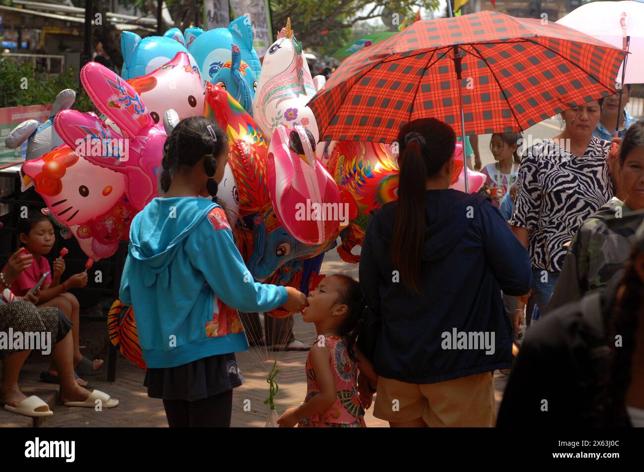 Colourful balloons for sale at at the Pi Mai parade in Luang Prabang ...