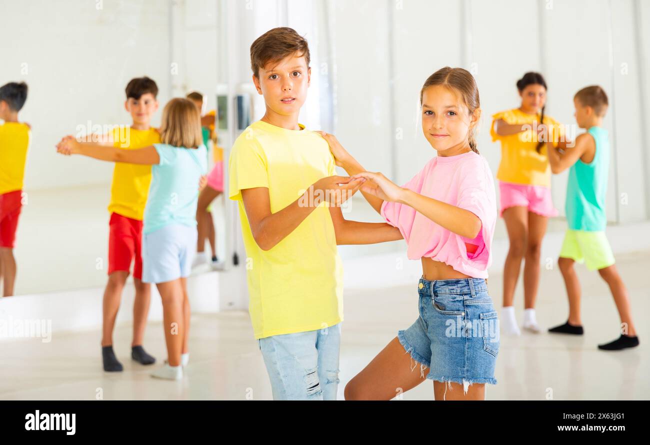 Group of kids dancing salsa in studio Stock Photo - Alamy