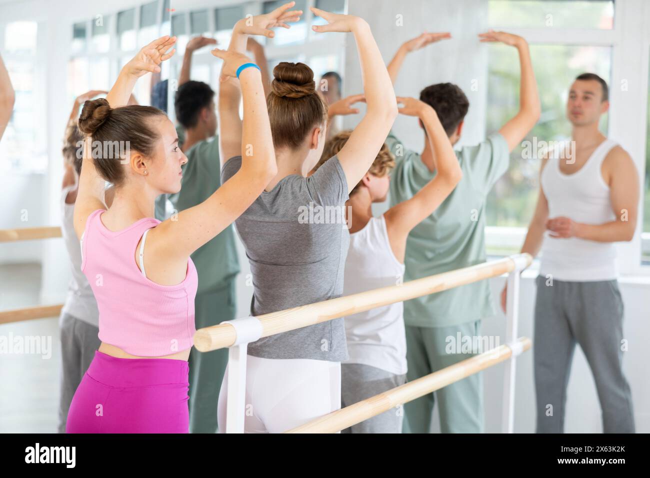 Teenage girl practicing ballet positions in dance studio Stock Photo ...