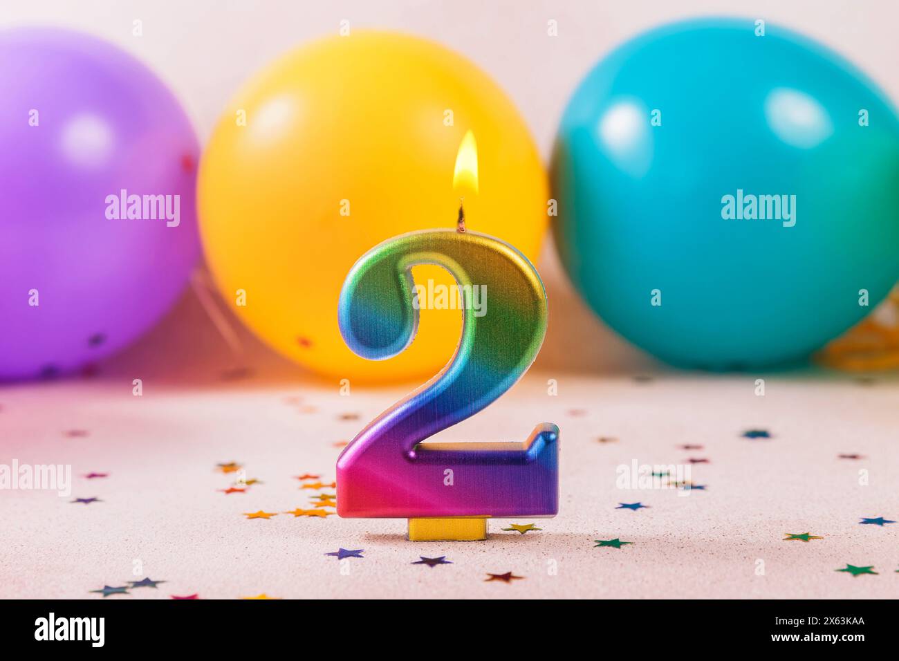 Number 2 Candle Celebration: Colorful Party Theme Stock Photo - Alamy