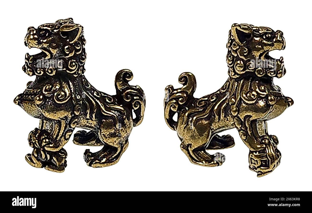 Side view of a female and male foo dogs facing away from each other ...