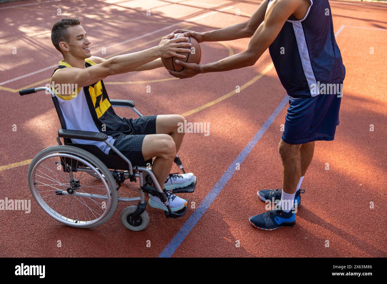 Basketball player with disability training on basketball court Stock ...