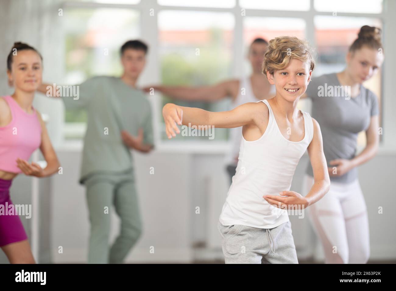 Teenage boy practicing ballet positions in dance studio Stock Photo - Alamy