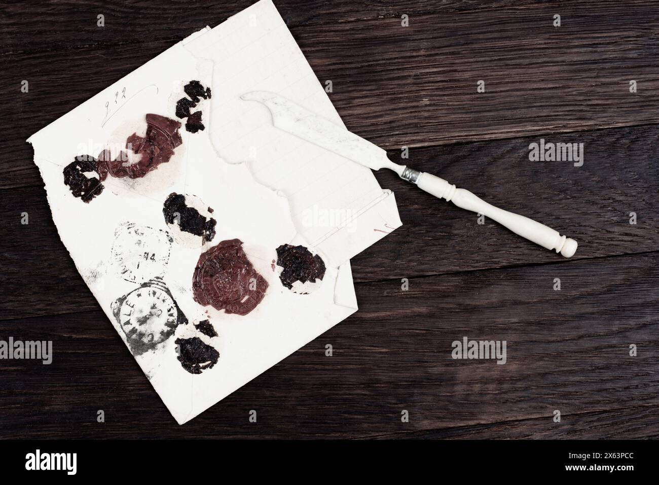 Retro envelope opener knife vintage letter envelope on wooden desk ...