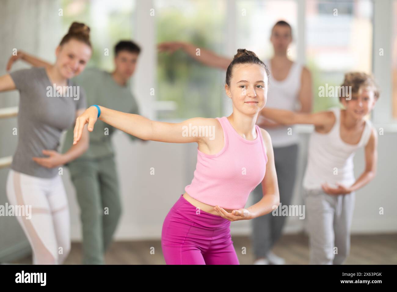 Girls and boys are learning various dance and ballet movements in ...