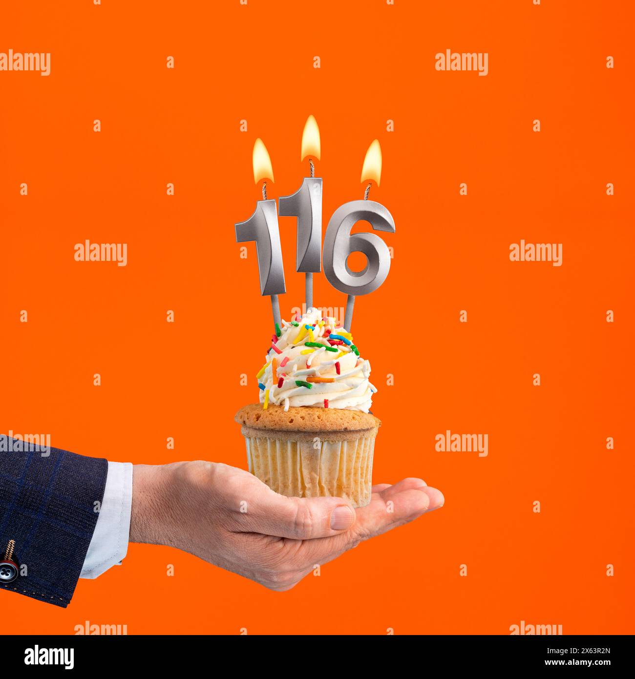 The hand that delivers cupcake with the number 116 candle - Birthday on ...