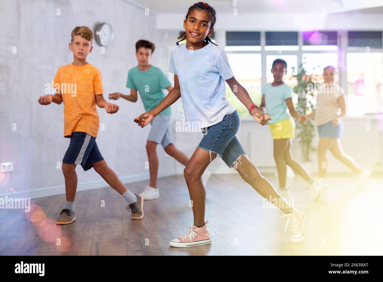 African boy perform choreographic exercises and teach energetic social ...