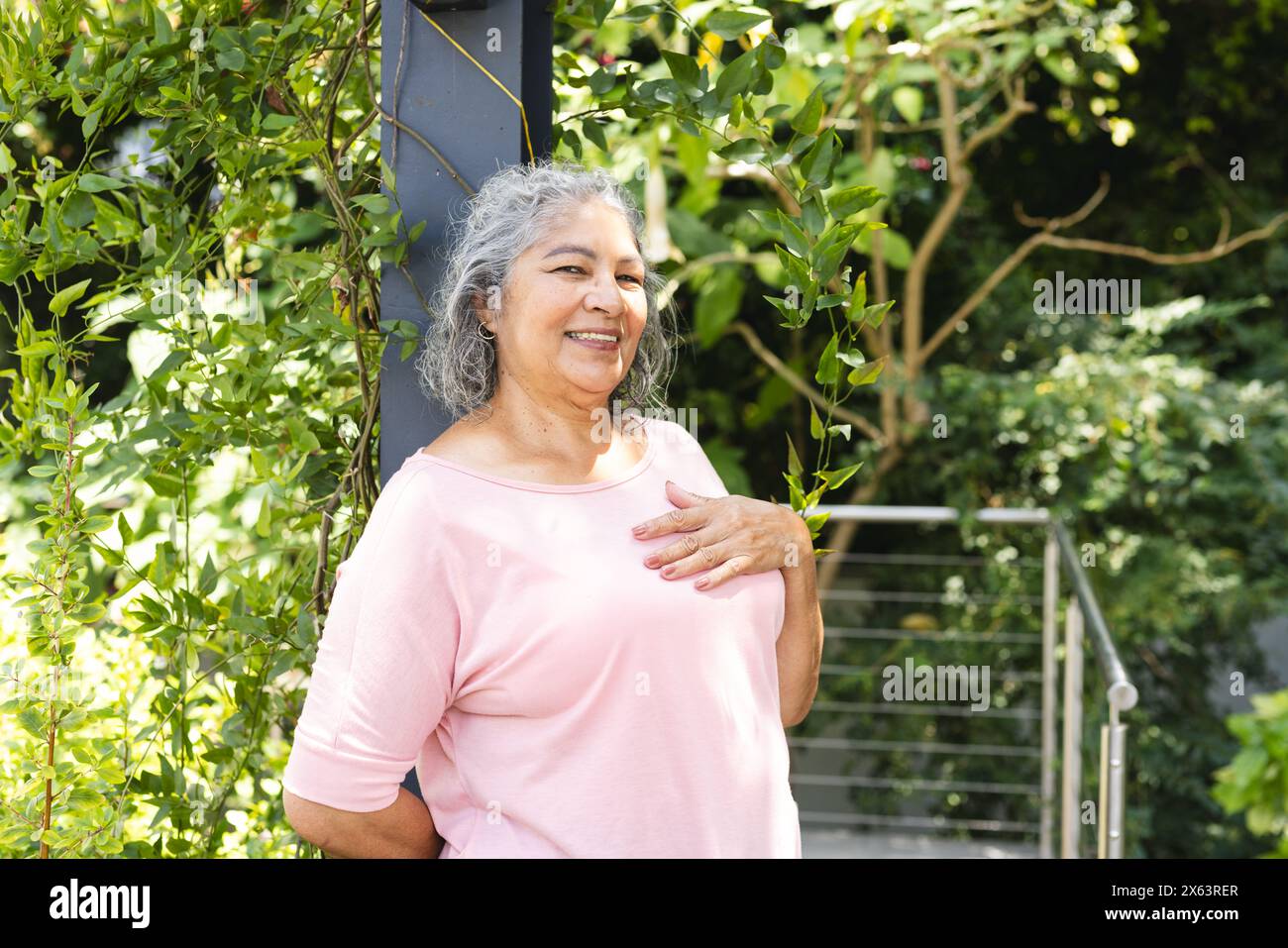 Hand on chest woman happy hi-res stock photography and images - Alamy