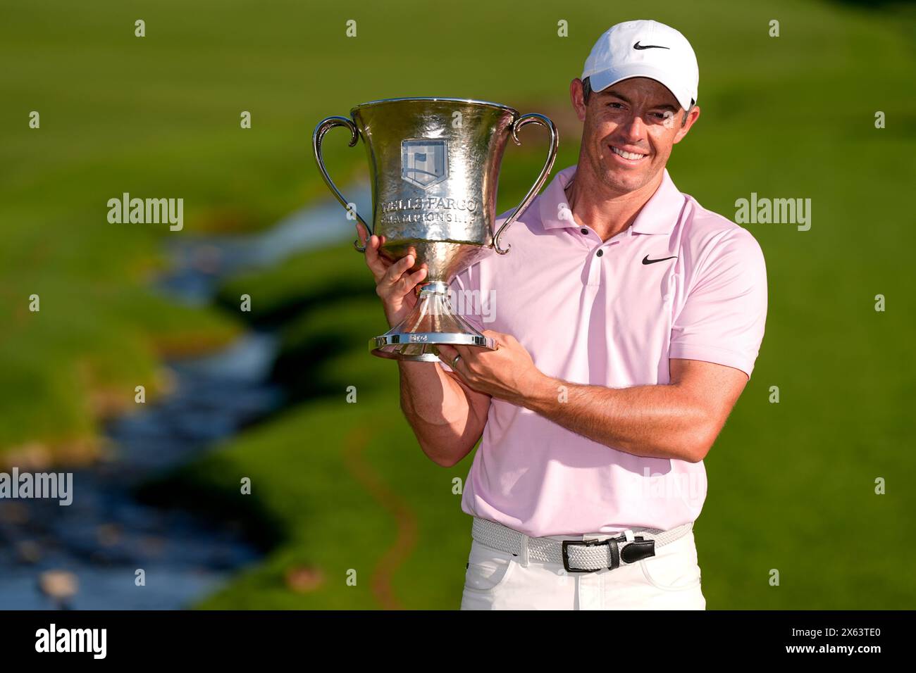 Rory McIlroy, of Northern Ireland, holds the trophy after winning the ...