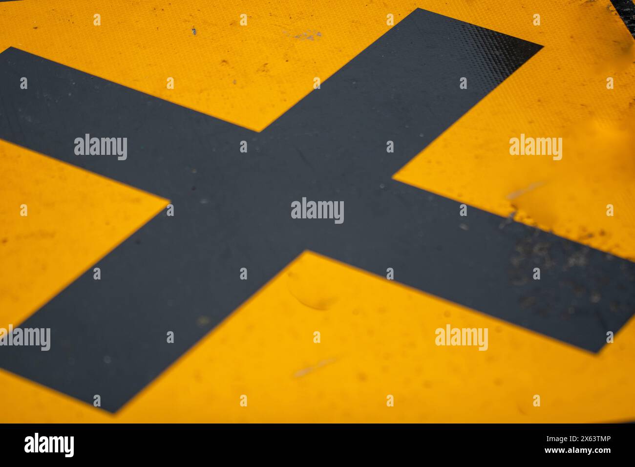 Yellow road warning sign shot close up Stock Photo - Alamy