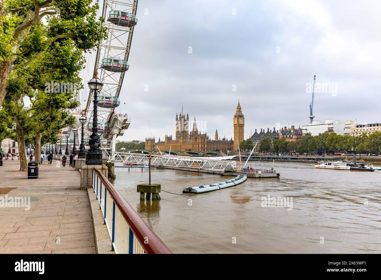 London South Bank view along the River Thames past the London Eye to ...