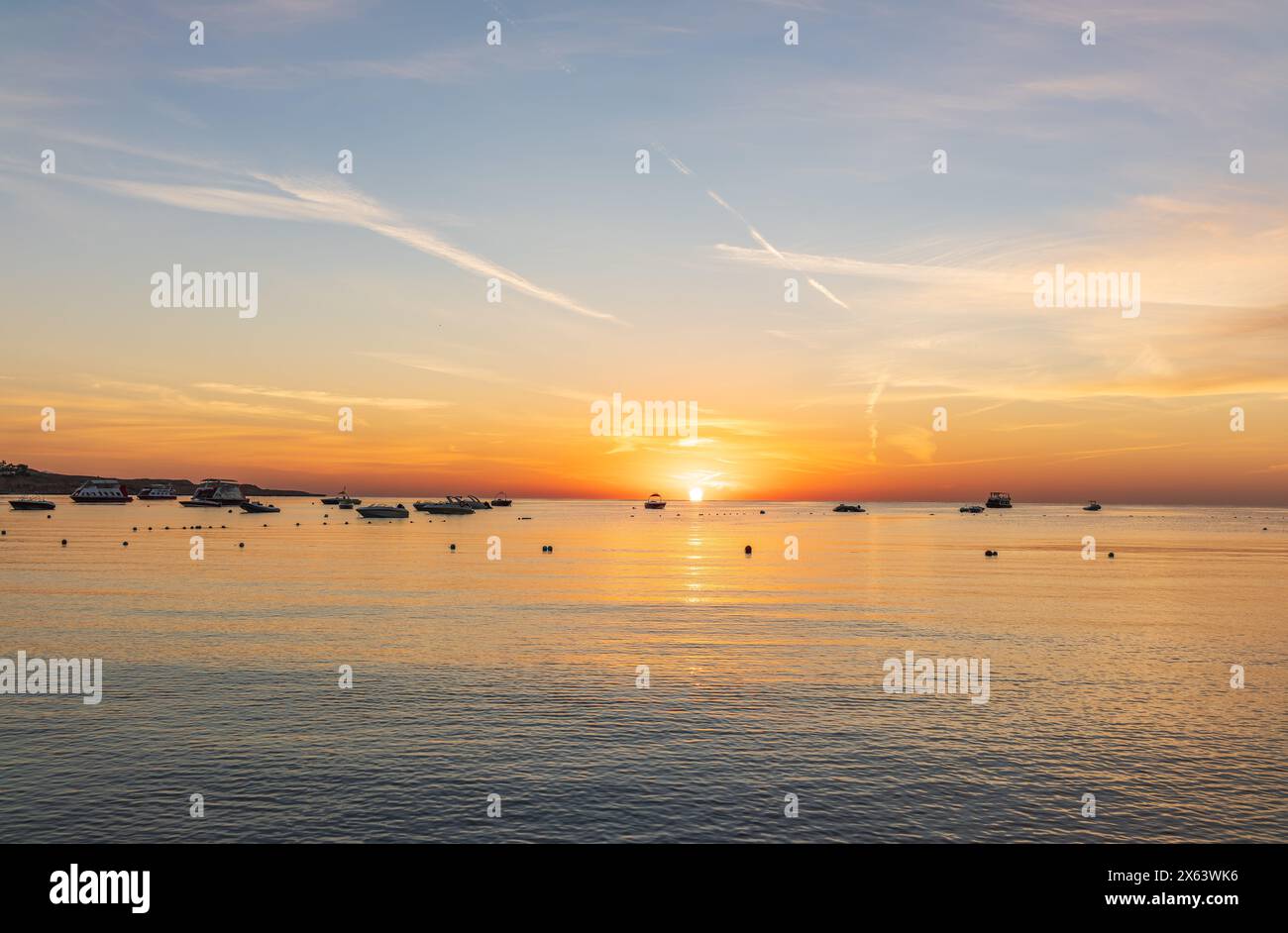 Sunrise over the sea. Panoramic seascape. Burning sky and shining ...