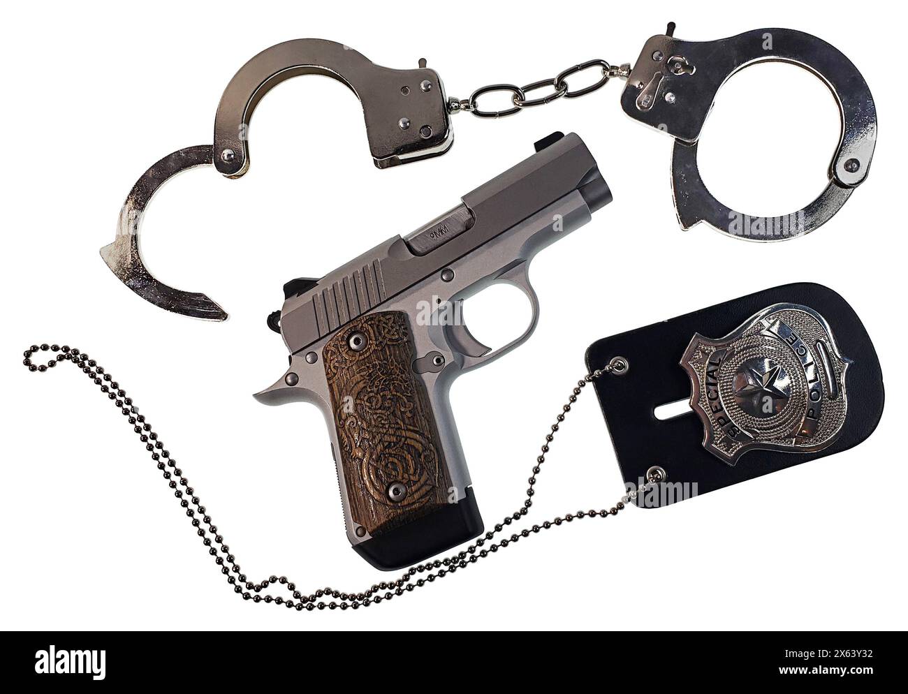 Silver metal 9mm gun with handcuffs and police badge Stock Photo - Alamy