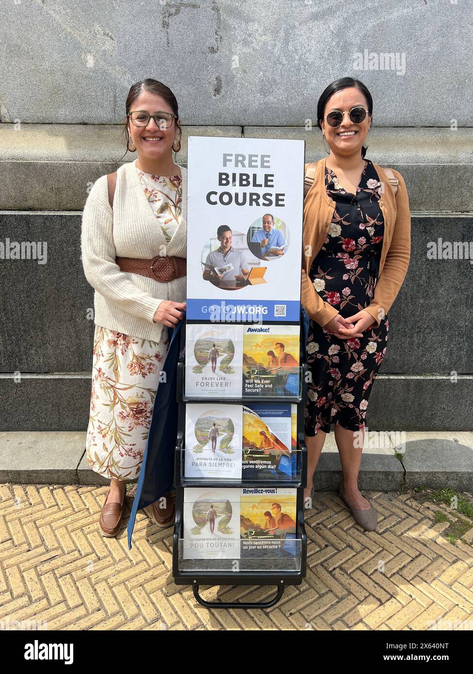Members of the Jehovah’s Witnesses Christian group offer literature at ...