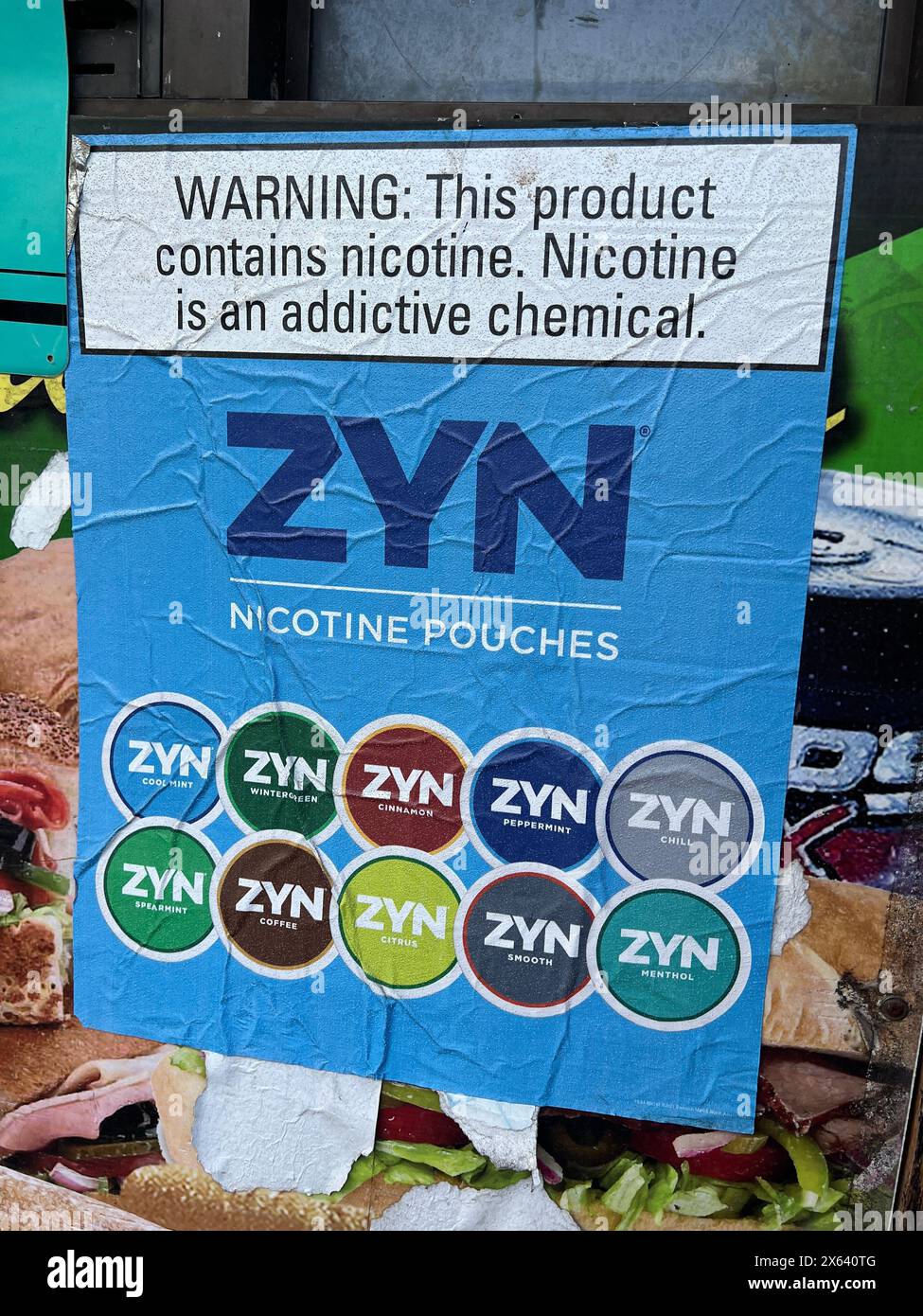 Warnings about the drug nicotine in legal products on the window of a ...