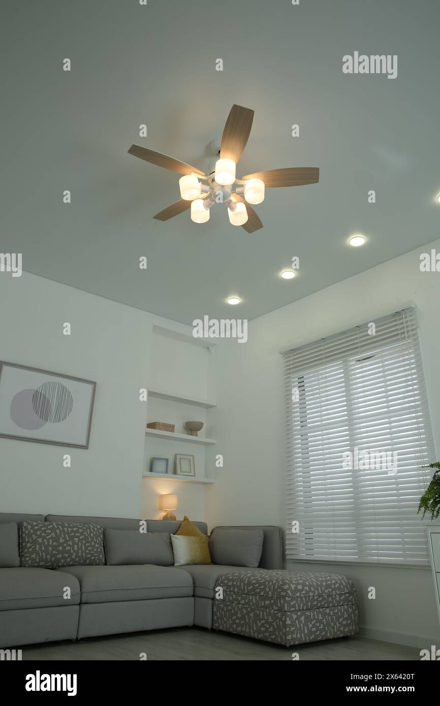 Ceiling fan, furniture and accessories in stylish living room, low ...