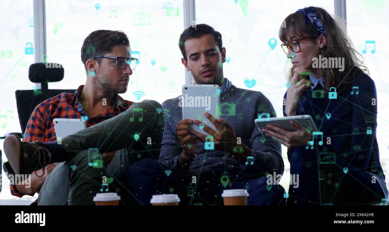 Image of network of digital icons against diverse group of colleagues ...