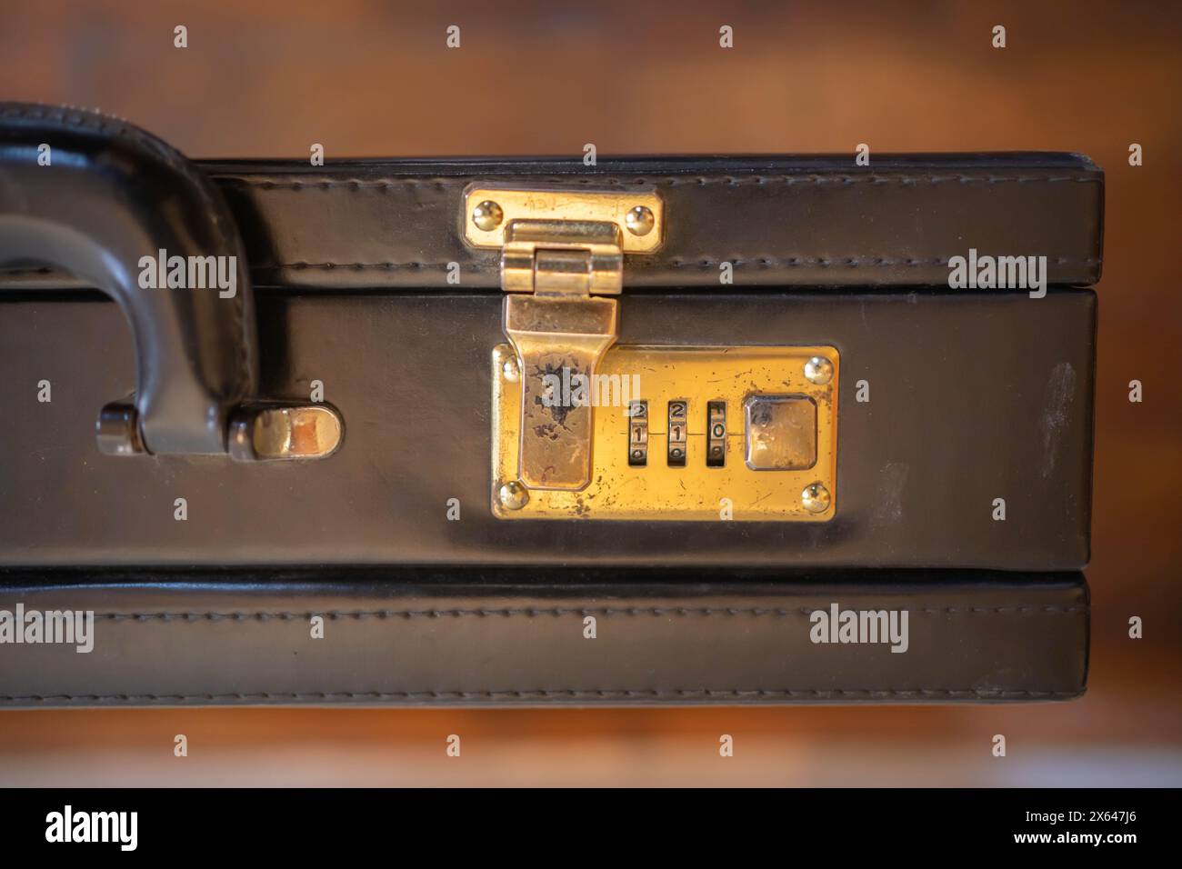 Old briefcase with lock code Stock Photo - Alamy